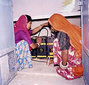 Barefoot Female and a Solar Engineer